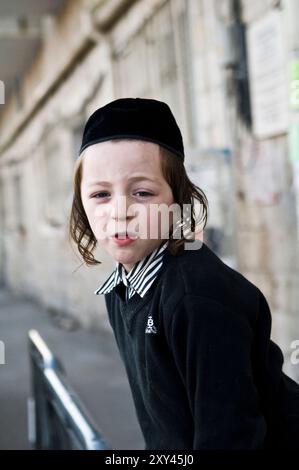 Ultra-Orthodox Jewish children and men , some dress up in , celebrate ...