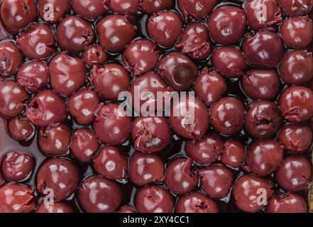 Fresh made Canned Cherries on a vintage background as detailed close-up ...