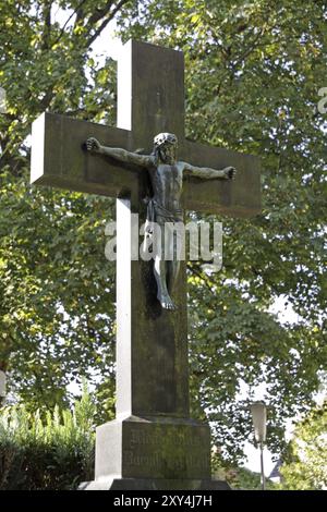 Grave cross with crucified man Stock Photo - Alamy