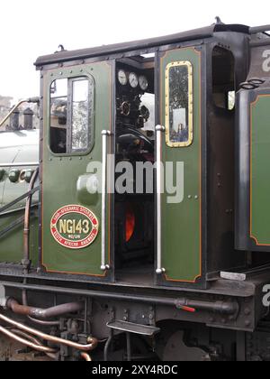 Driver's cab of an old steam locomotive with the modern train control ...