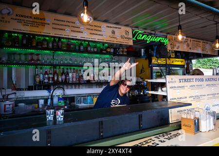 Bartender of the Bar D'Arepa greets the photographer with the Hang ...