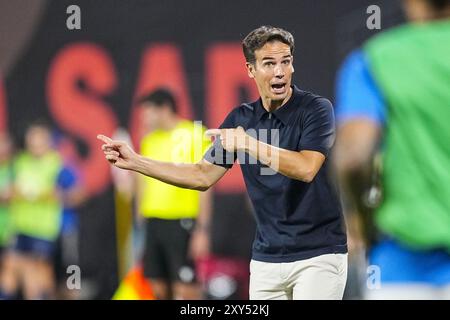 Inigo Perez, head coach of Rayo Vallecano greets Hansi Flick, head ...