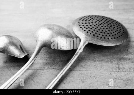 Three metal soup ladles and skimmers in different sizes Stock Photo - Alamy