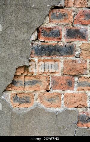 The facade of a damaged apartment block. Broken windows and traces of ...