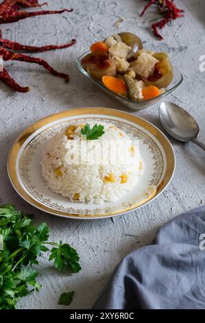 Turkish traditional food, rice pilaf with chickpea with pickle on ...