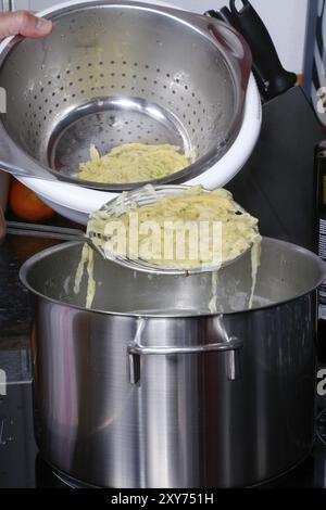 Swabian cuisine, preparation of herb spaetzle for roast beef, scooping ...