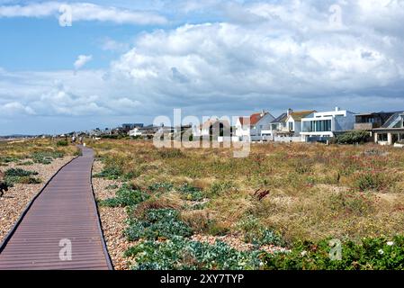 Exclusive houses on the foreshore at Shoreham beach on a hot sunny ...