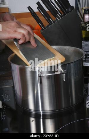 Swabian cuisine, preparation of herb spaetzle for roast beef, scraping ...