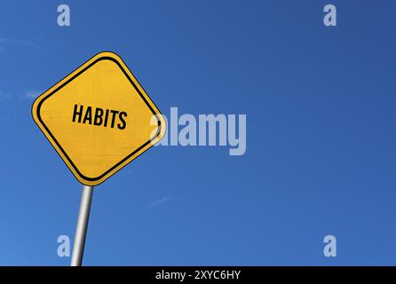 Habits - yellow sign with blue sky Stock Photo - Alamy