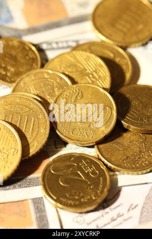 Many Euro coins on Euro banknotes Stock Photo - Alamy