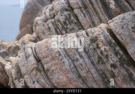 Grey and pink gneiss metamorphic rock Stock Photo - Alamy