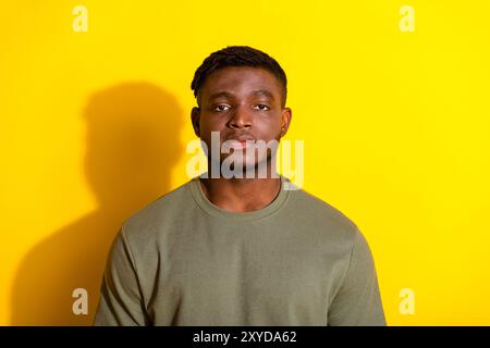 Photo of strong masculine virile guy show two biceps wear green sweater ...