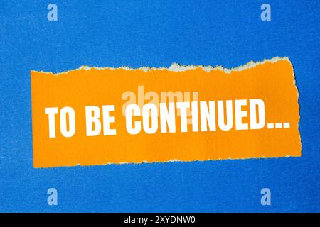 To be continued message written on ripped torn cardboard paper with ...