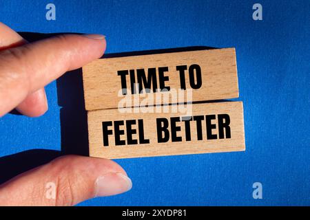 Time to feel better message written on ripped torn yellow paper with ...