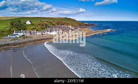 Sandend Aberdeenshire Scotland in summer a rocky shoreline a collection ...