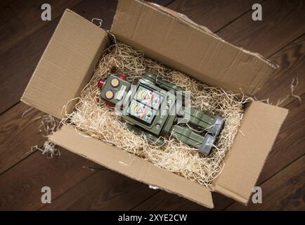 retro robots with gifts on a old wooden floor with reflection Stock ...