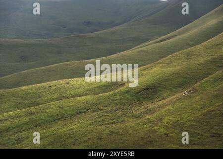 Foggy shot of a beautiful landscape with dancing clouds in the ...