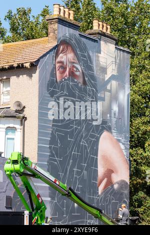 Smug Sam Bates street art painting of his grandparents on a wall in ...