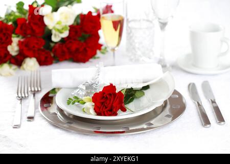 A closeup shot of an arranged wedding reception table with flowers ...