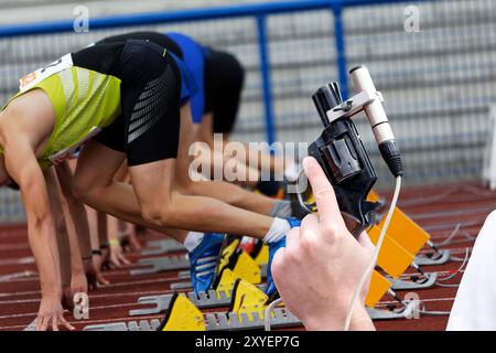 Man at starting position, waiting for signal, side view Stock Photo - Alamy