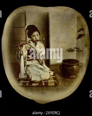 Uchiwa Fan - A woman playing a Kagurabue flute, 1900-1910 unknown photo ...