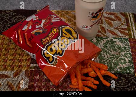 Cheetos crunchy with a glass of milk. Charles Elmer Doolin invented ...