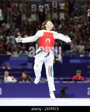 Refugee Paralympic Team's Zakia Khudadadi celebrates victory over ...