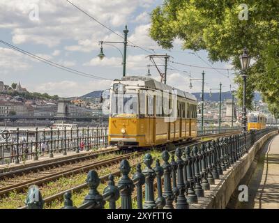 Yellow urban tram runs along the city tracks, street photography Stock ...
