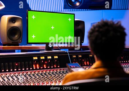 African american expert working at mixing panel in recording studio ...