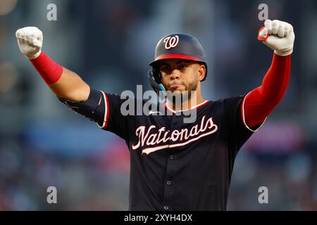 Washington Nationals' Luis Garcia Jr. is congratulated in the dugout ...