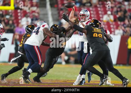New England Patriots quarterback Drake Maye (10) warms up before an NFL ...