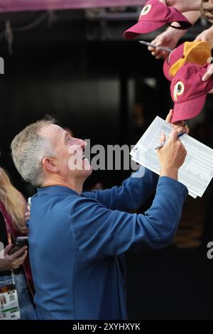 Washington Commanders owner Josh Harris, right, talks with Atlanta ...