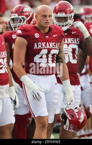 Arkansas defensive lineman Landon Jackson stretches before he runs a ...