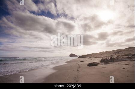 Beach section with shipwreck Stock Photo - Alamy