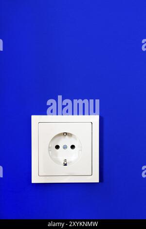 Electric outlets on painted wall Stock Photo - Alamy