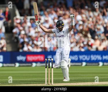 Gus Atkinson of England celebrates his maiden century (100 runs) during ...