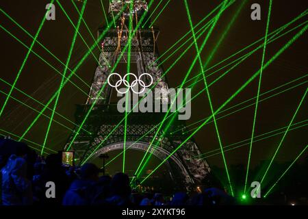 A crowd watches the opening ceremony of the 2024 Olympic Games on ...