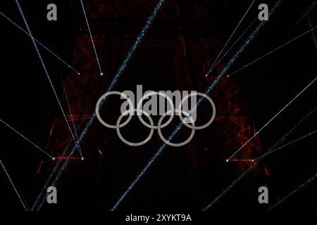 A crowd watches the opening ceremony of the 2024 Olympic Games on ...