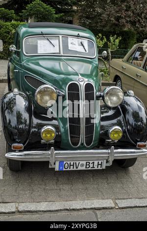 A row of classic BMW cars on display at the BMW Museum in Munich ...