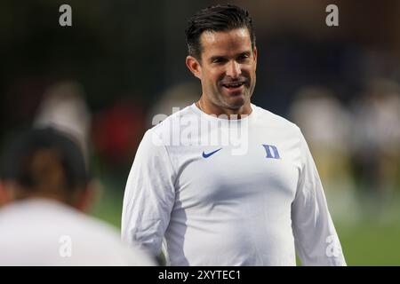 Duke head coach Manny Diaz, front left, enters the field before an NCAA ...