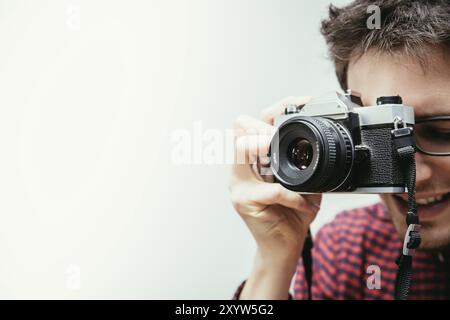 A man in a shirt flips a red chip. Bet on red. Poker chip in the air ...