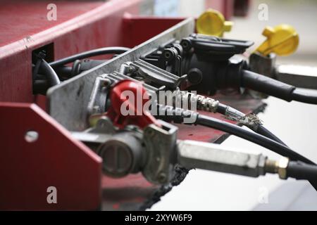 Connecting cables and plugs on a lorry between tractor unit and trailer ...