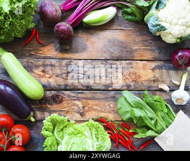 aw organic natural vegetables on wooden background. Top view. Copy ...