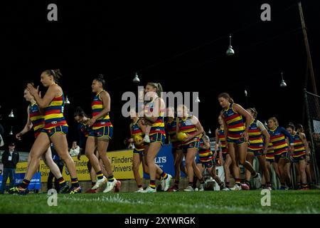 Power players run onto the field during the Round 9 AFL match between ...