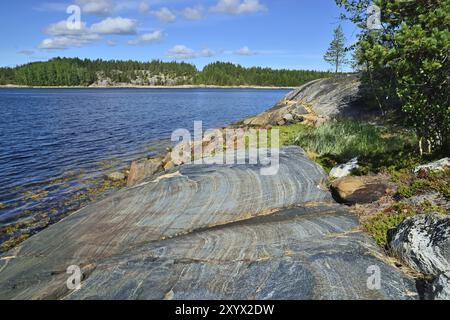 Beautiful Karelian landscape - colorful rocks on the beach. Bay Chupa ...