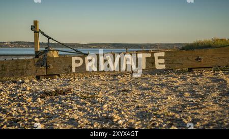 Sign: Private, seen at Shellness Beach on the Isle of Sheppey, Kent ...
