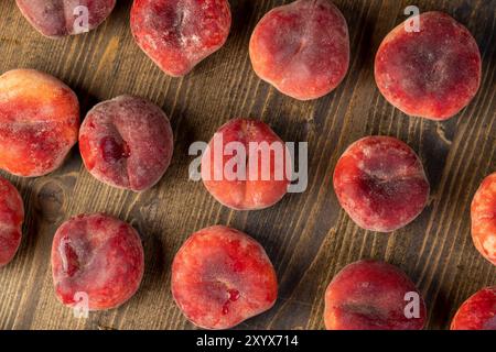 flat ripe and soft peaches after washing, some in drops of water Stock ...