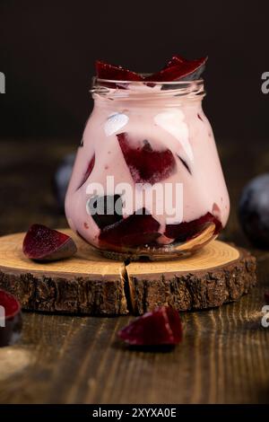 plum fruits and plum-flavored yogurt, plum yogurt with slices and whole ...