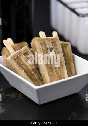 Cola Popsicles (close-up shot, selective focus) isolated on white ...