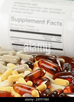 Composition with dietary supplement capsules and containers. Variety of ...
